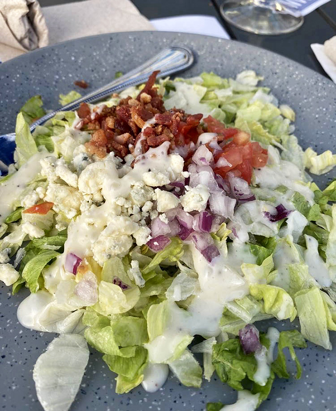 A salad that doesn't apologize for being a salad&mdash;crisp greens, bacon crumbles, and blue cheese proving healthy can be indulgent too.