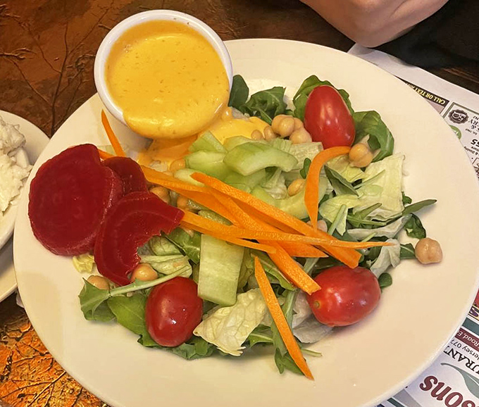 A garden-fresh salad that proves vegetables can be more than just a guilt-offering to your doctor. Those vibrant colors are practically showing off.