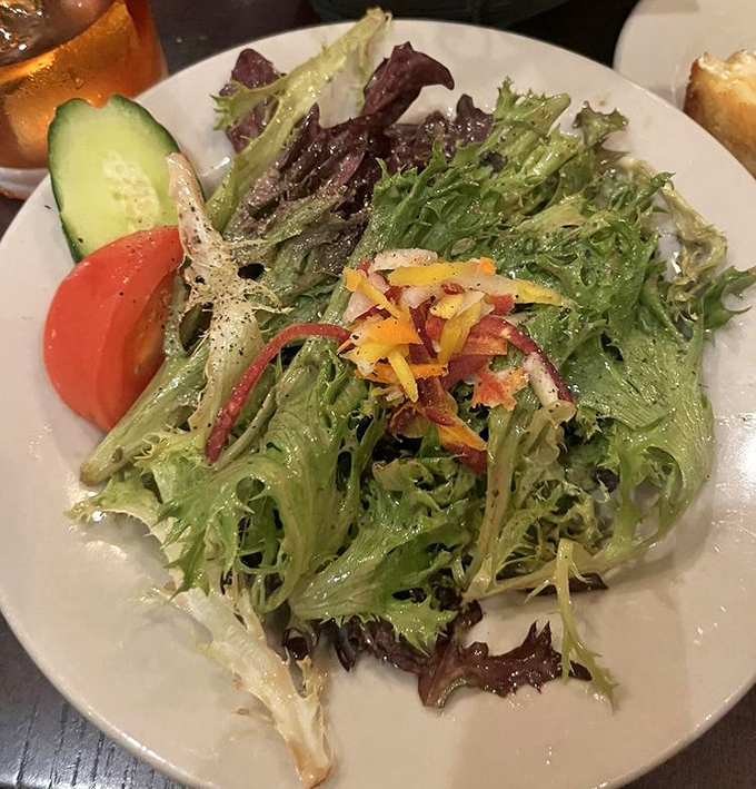 A salad that doesn't apologize for being a salad. Fresh, vibrant, and adorned with colorful toppings &ndash; the opening act that deserves its own standing ovation.