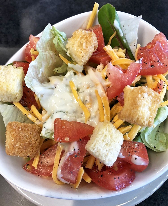 A salad that doesn't apologize for being at a breakfast joint. Those croutons are dressed for the occasion.