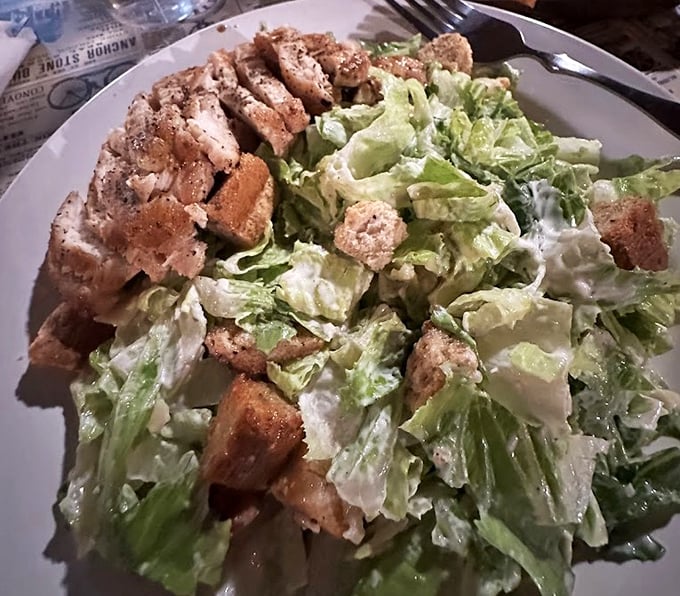 A classic Caesar salad with perfectly grilled chicken&mdash;because sometimes you need something green before diving into Idaho's more indulgent offerings.