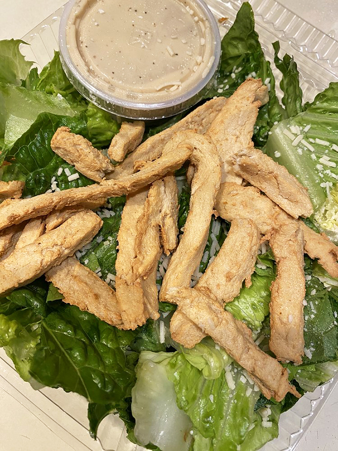 Even the salads at Gooey Looies refuse to be boring. Those chicken strips aren't just toppings&mdash;they're the main event.