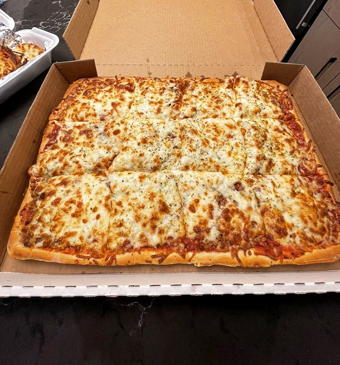 The sheet pizza that launched a thousand dinner parties. Orsi's rectangular masterpiece proves that geometry and gastronomy make perfect partners.