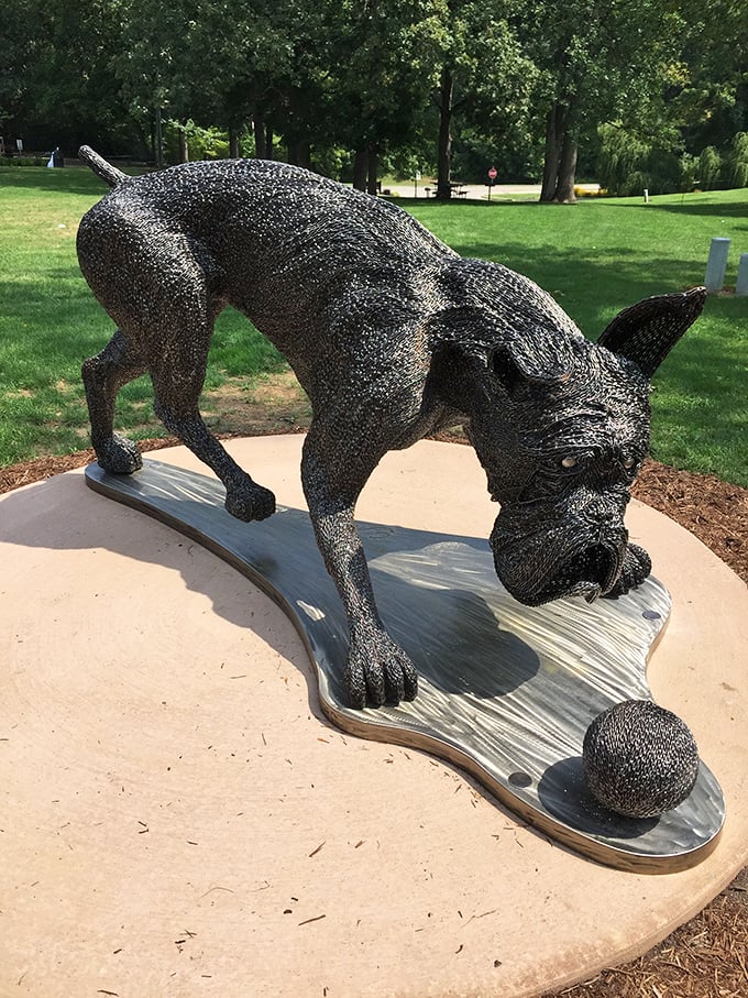 This playful metal canine at Scovill Sculpture Park seems to ask, "Ball? Did someone say ball?" &ndash; art that speaks a universal language. 