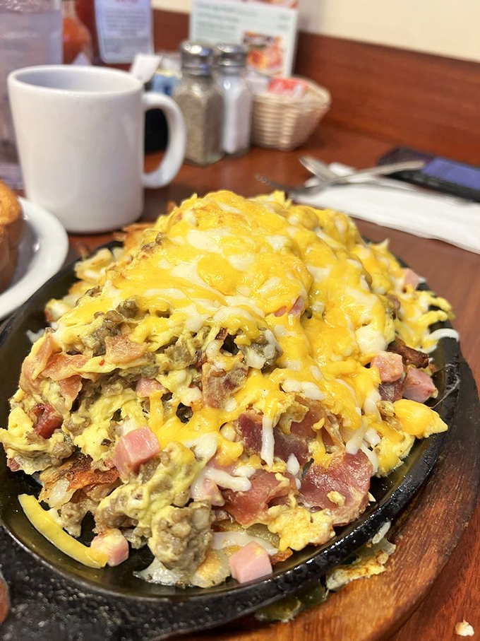 The skillet &ndash; where breakfast ingredients go to find their higher purpose. A mountain of morning goodness topped with melted cheese.