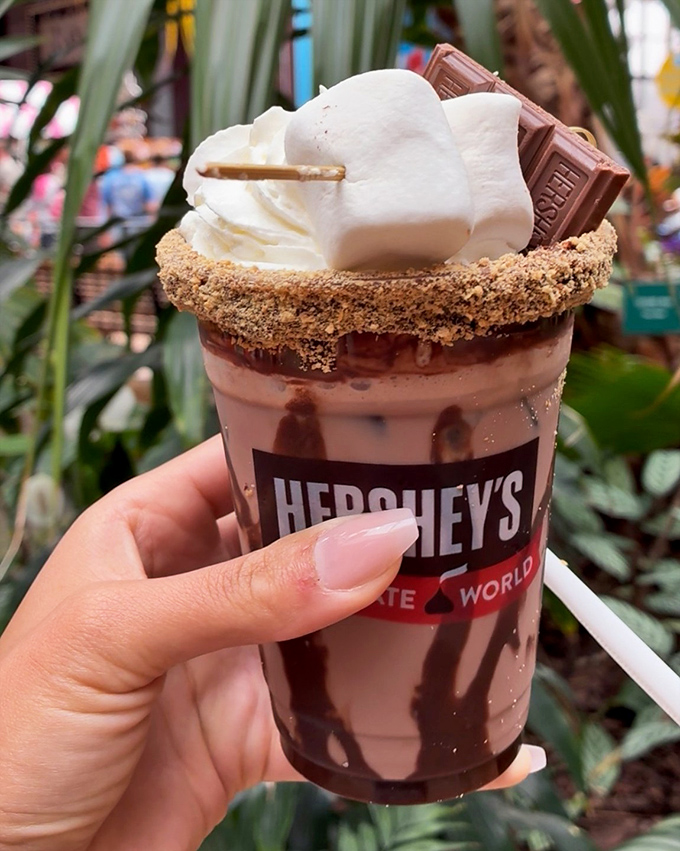 This chocolate milkshake with its graham cracker rim isn't just a drink&mdash;it's a structural engineering marvel topped with a chocolate bar sail.