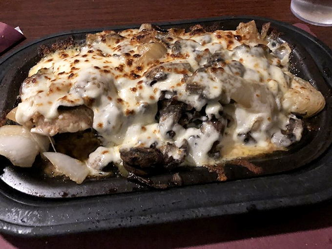 Chicken smothered in mushrooms, onions and cheese&mdash;proof that sometimes the best things in life need no breathing room.