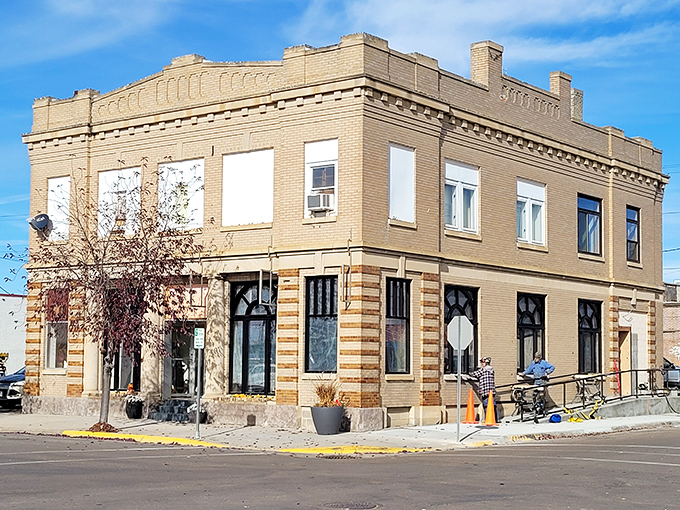 Soma-Dis Deli occupies a corner building where the striped brick detailing proves even practical structures can wear fancy pants.