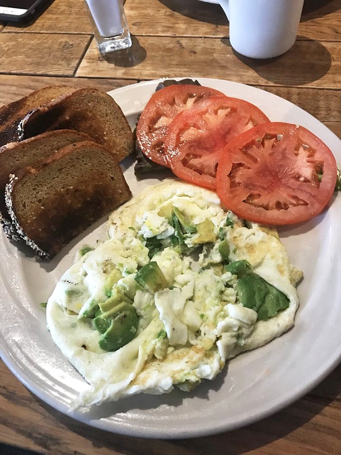 Simple perfection: eggs, toast, and fresh tomatoes. Sometimes the best breakfast is the one that doesn't try to outsmart itself.
