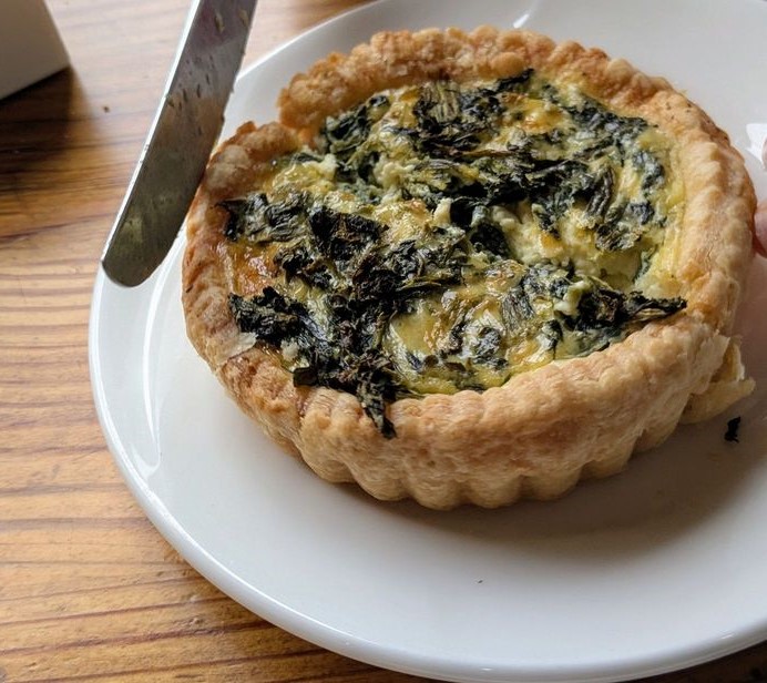 A spinach quiche with a crust so buttery and flaky it deserves its own fan club&mdash;the kind of breakfast that makes morning people out of night owls.