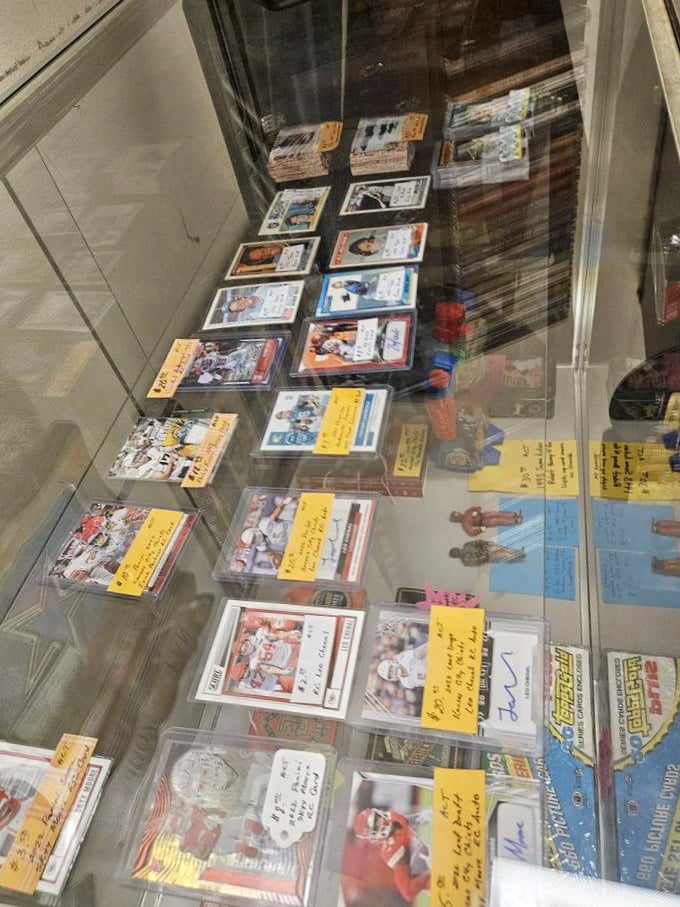 Sports cards that capture moments of athletic glory, preserved under glass. Each one a time capsule of childhood heroes and stadium dreams.