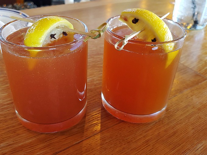 These ruby-red cocktails with lemon wheels and cloves aren't just drinks&mdash;they're liquid sunshine perfect for washing down smoky bites.