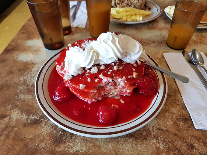 Strawberry pancakes crowned with whipped cream &ndash; dessert masquerading as breakfast, and nobody's complaining about the deception.