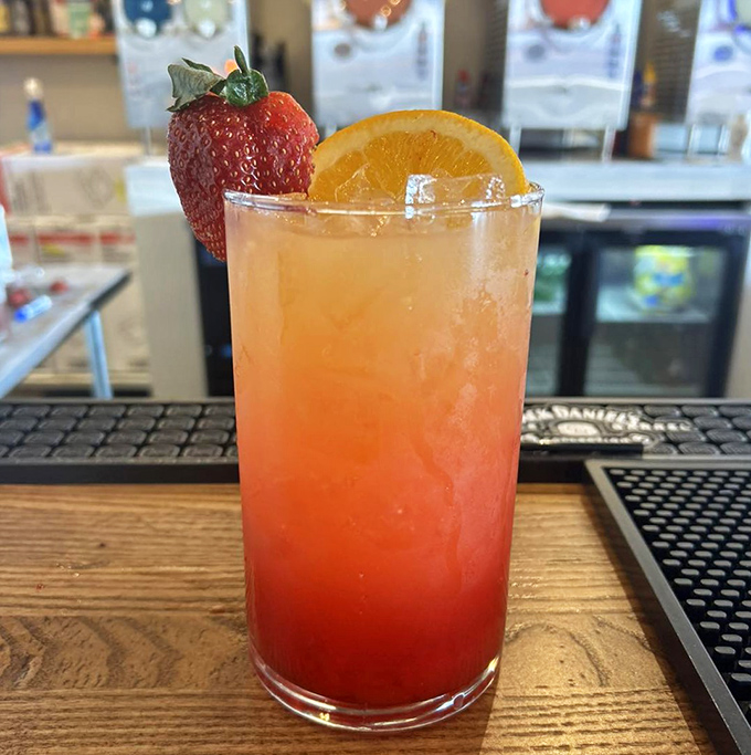 This isn't just a cocktail; it's summer in a glass, complete with strawberry, orange, and enough spirit to start the weekend right.