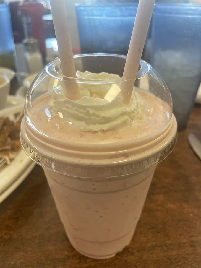 A strawberry shake that demands two straws&mdash;not for sharing, but for maximum milkshake efficiency when one inevitably clogs with creamy goodness.