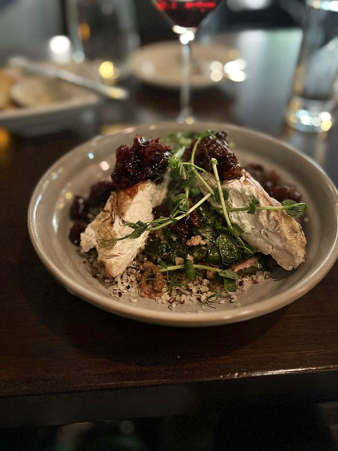Chicken breast stuffed with dreams and cranberry chutney, resting on a bed of quinoa that's actually worth eating.