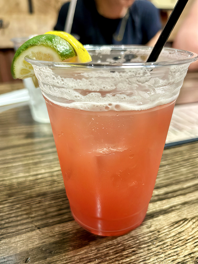 A refreshing summer cocktail garnished with citrus that says, "Yes, beer is our thing, but we respect your life choices."