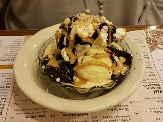 The ice cream sundae arrives loaded with toppings, because apparently they believe in finishing what the mashed potatoes started magnificently.