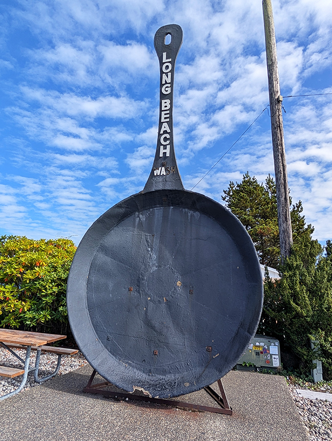 Sunshine glints off the massive black surface, highlighting every detail of this roadside wonder that's been flipping visitors' expectations for decades.