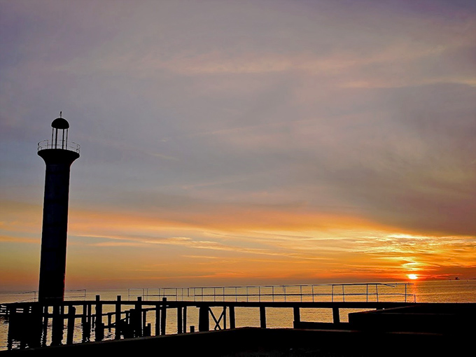 Silhouetted against a painted sky, the lighthouse transforms into something straight out of a Hemingway novel &ndash; minus the drama.