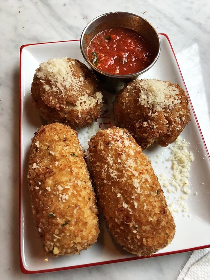 Golden-fried suppli that crunch like your favorite childhood memory. These Italian rice balls are what mozzarella sticks dream of becoming when they grow up.