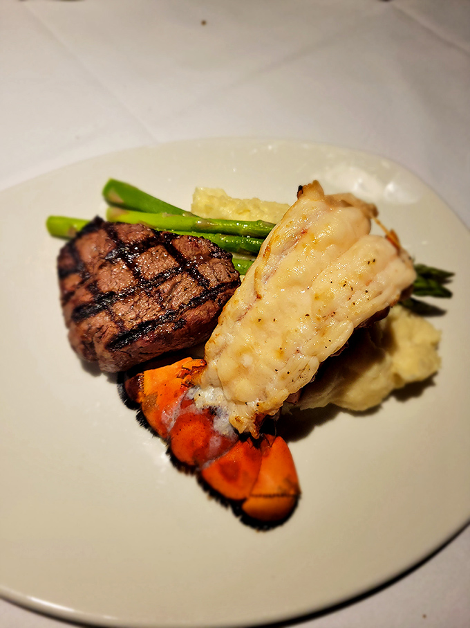 The ultimate land-and-sea romance: perfectly grilled filet mignon courting a succulent lobster tail, with asparagus playing chaperone. Surf and turf nirvana!