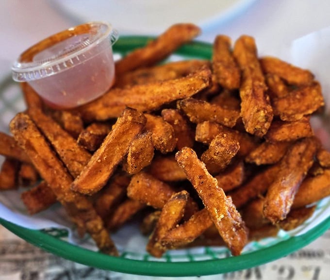 Sweet potato fries with the perfect crisp-to-soft ratio and a dipping sauce that makes you wonder why regular potatoes get all the attention.