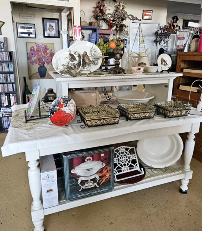 Tabletop treasures arranged with the care of a museum curator. That white farmhouse table could star in its own HGTV makeover show.