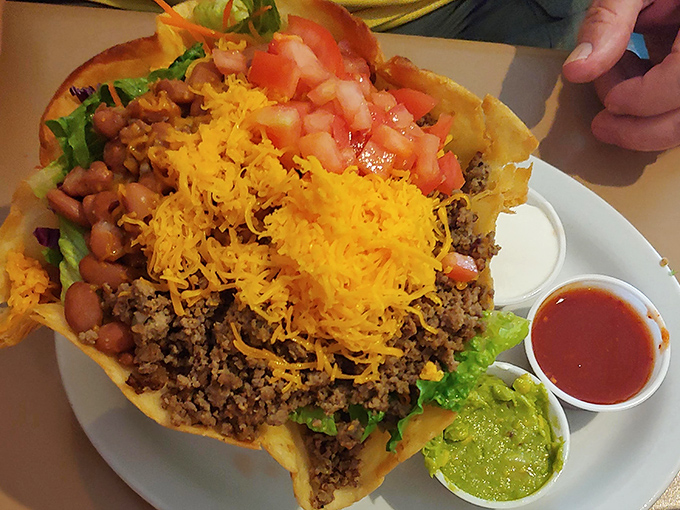 A taco salad that refuses to be a mere appetizer. This edible architecture combines crispy, creamy, and spicy in perfect harmony. 