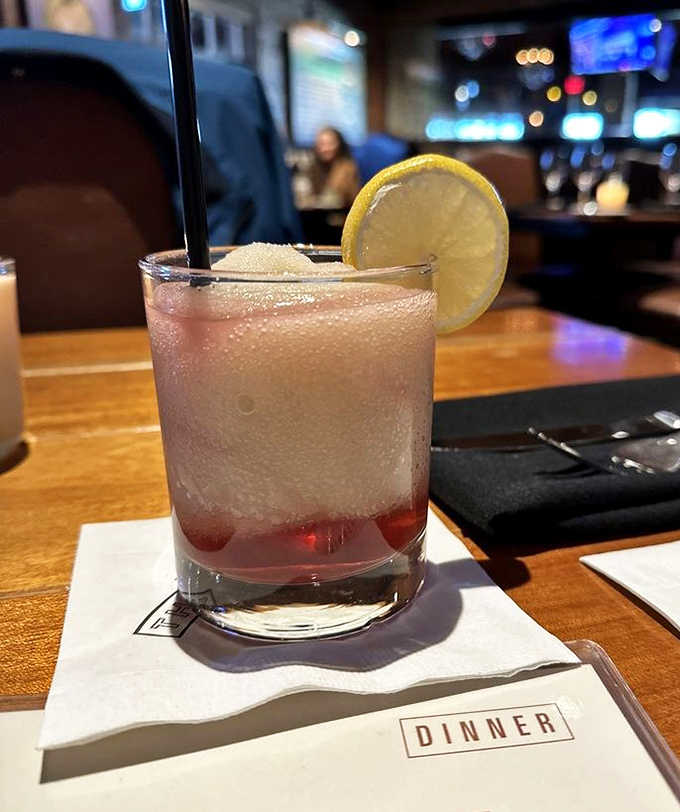 This refreshing cocktail with its festive cherry garnish proves that Texas knows how to keep things cool and classy.