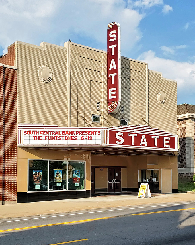 The Historic State Theater's vintage marquee lights up downtown with nostalgic charm, promising entertainment that doesn't require buffering or passwords.