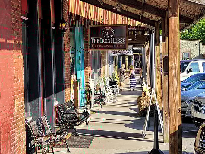 The Iron Horse's wooden porch invites you to slow down, maybe sit a spell—the quintessential Southern invitation that never goes out of style.