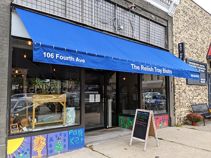 The Relish Tray Bistro's cheerful blue awning beckons like an old friend, promising comfort food with just enough sophistication to make you feel special.