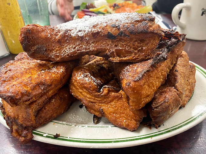 French toast that's been working out &ndash; thick-cut, golden-brown, and ready to soak up maple syrup like it's training for the breakfast Olympics.