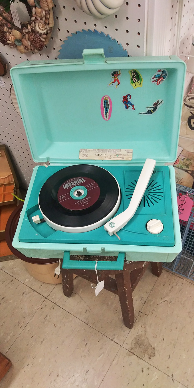 This turquoise record player isn't just vintage tech&mdash;it's a portal to sock hops and summer crushes, complete with superhero approval.