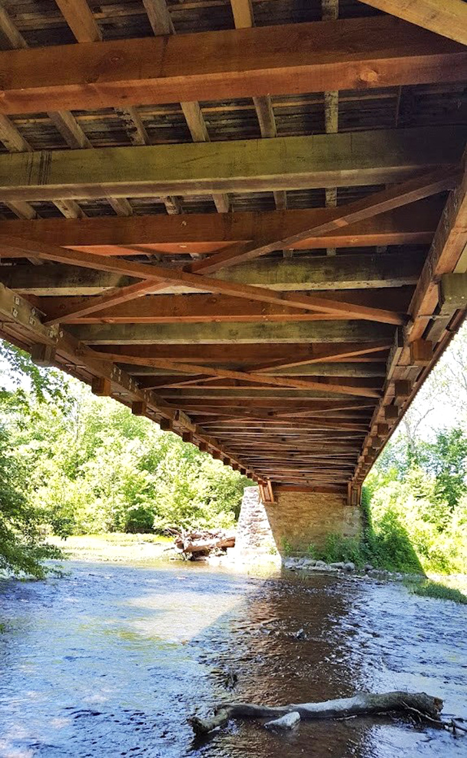 Engineering poetry from below. The geometric precision of these wooden trusses has kept travelers dry and safe for over a century.