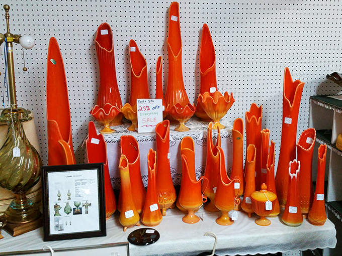 Orange glass vases arranged like a sunset captured in ceramic, bringing warmth to any room.