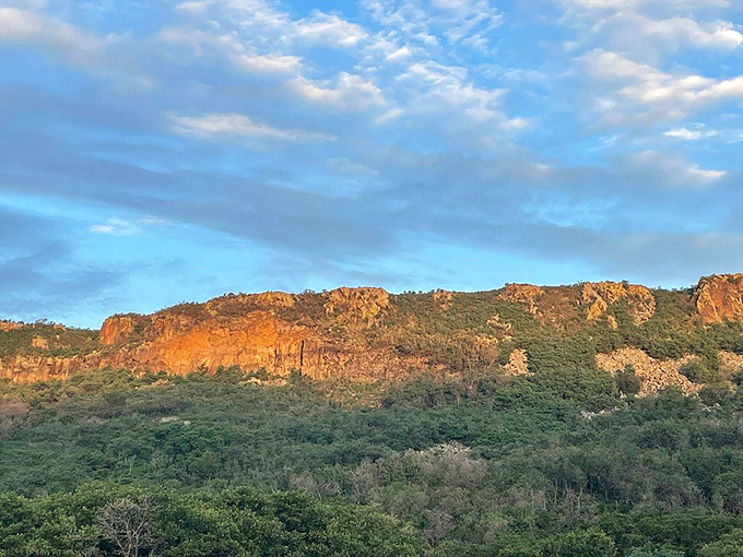 Sunset bathes the canyon walls in amber light, transforming ordinary rock into nature's own version of molten gold.