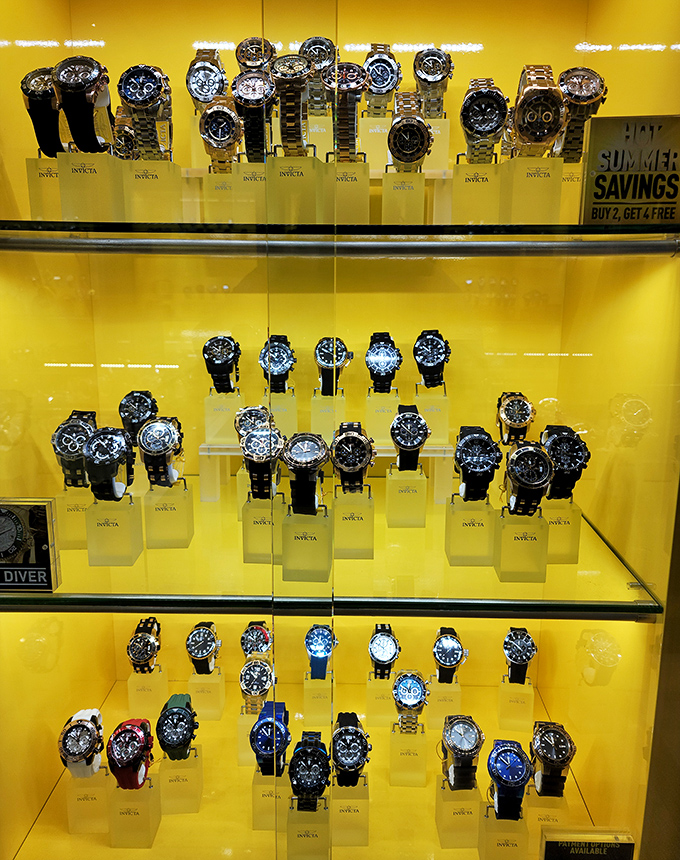 Invicta watches gleaming under display lights&mdash;because nothing says "I got a deal" like a timepiece that looks twice its price tag.