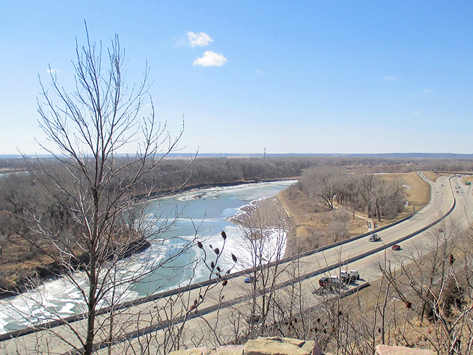 The Missouri River curves through the landscape like nature's signature, with highways hugging its contours&mdash;a reminder of the waterway's historical importance.