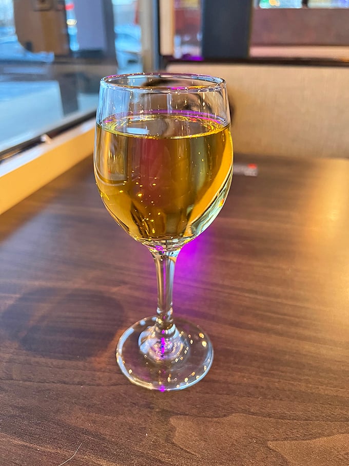 Wine in a pizza joint&mdash;because sometimes adulting means pairing your slice with something other than a fountain soda.