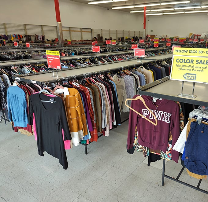 Women's clothing racks stretching into infinity, where designer dreams meet everyday budgets in perfect harmony.