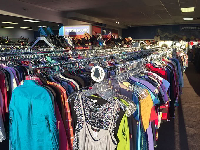 The clothing section stretches toward the horizon, a rainbow of possibilities organized by size and color for efficient treasure hunting.