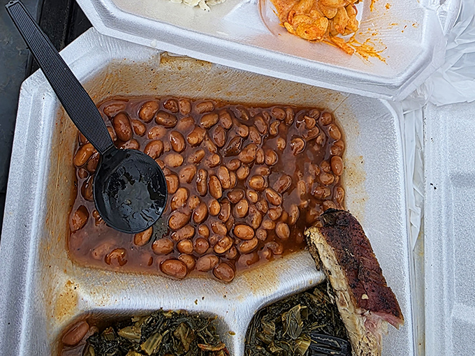 Baked beans that have clearly been taking notes during the smoking process. Those little legumes have absorbed stories that beans rarely get to tell.