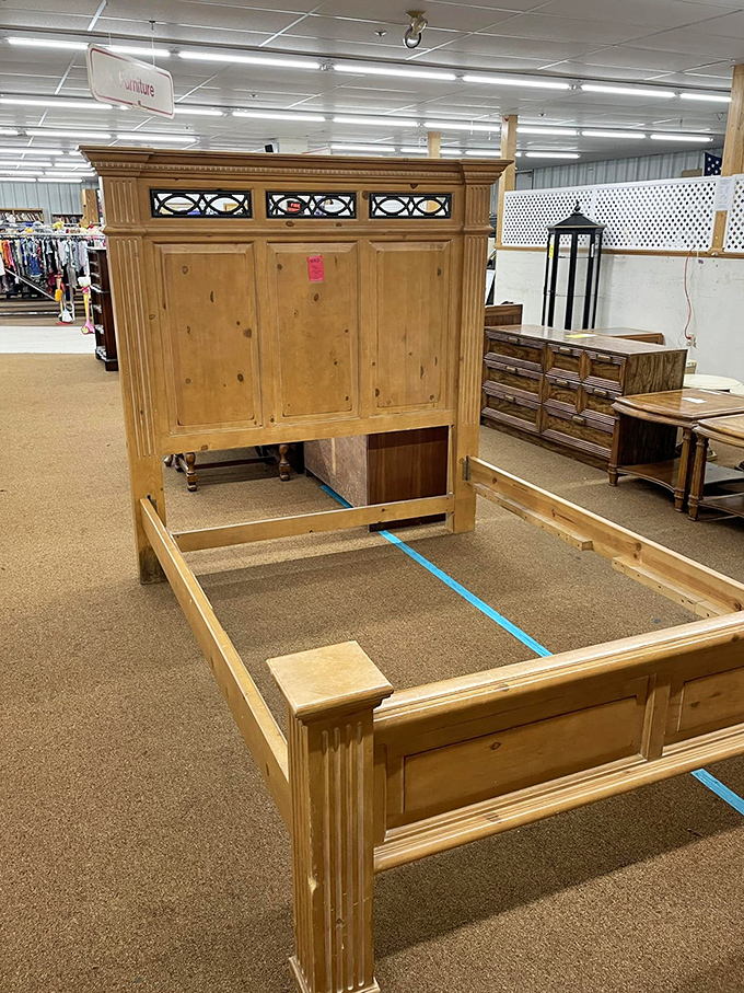 This pine bed frame with decorative glass inserts once graced someone's master bedroom. Now it awaits a second act in your guest room.