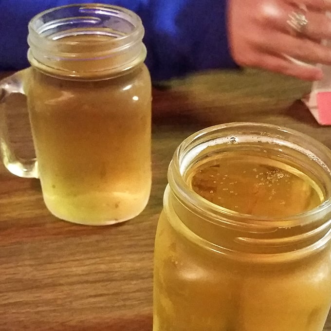 Cold beer served in mason jars&mdash;because sometimes the perfect beverage delivery system was invented generations ago. Practical perfection.
