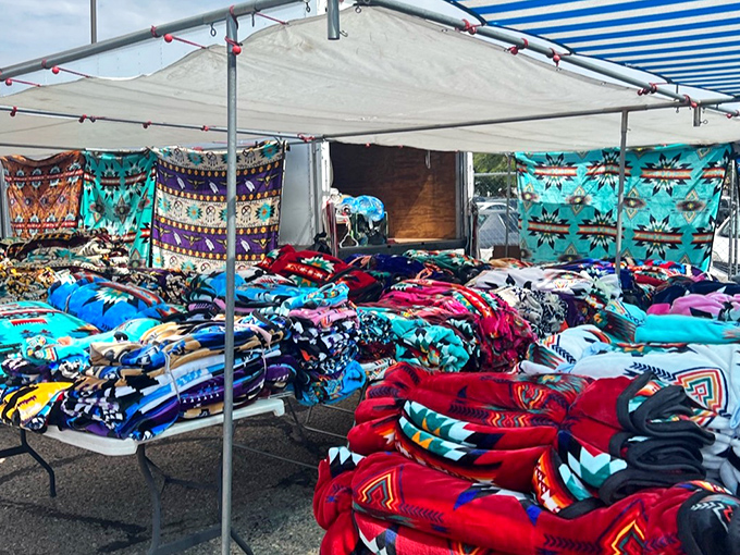 Blanket vendors offering woven warmth with geometric precision. Each pattern tells a story of heritage that's as comforting as the blanket itself.