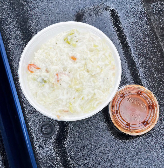 Cole slaw: the unsung hero of barbecue plates everywhere. This creamy counterpoint cuts through the richness like a cool breeze on a summer day.