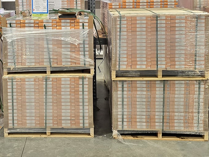 Pallets of flooring stacked like layer cakes of home improvement potential. Enough material here to transform an entire house.