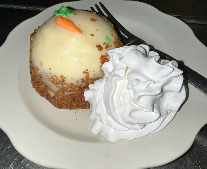 Carrot cake that doesn't need a fancy pastry case to prove its worth. That tiny carrot decoration is like the cherry on top of comfort.